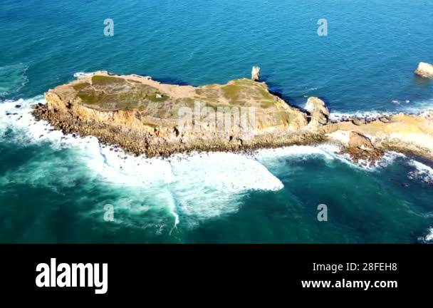 The Berlengas Archipelago in Portugal features a rocky island with ...