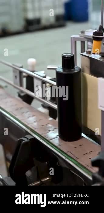 cosmetics production facility with packaging and assembly line. High ...