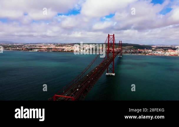 The 25 de Abril Bridge in Lisbon, Portugal, stretches over the Tagus ...