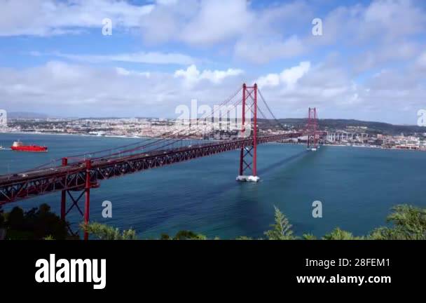 The 25 de Abril Bridge in Lisbon, Portugal, crosses the Tagus River ...