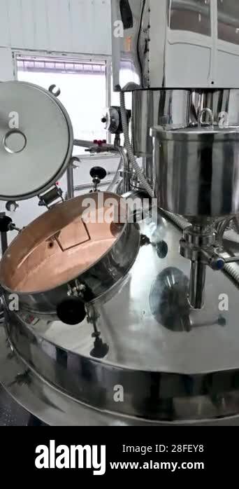 cosmetics production line with machines and packaging. High quality ...