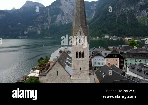 The picturesque village of Hallstatt in Austria features the iconic ...