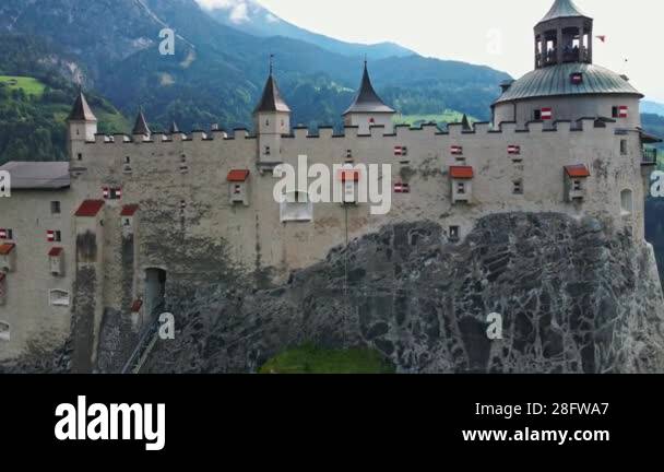 Hohenwerfen Castle stands on a rocky outcrop, featuring medieval towers ...
