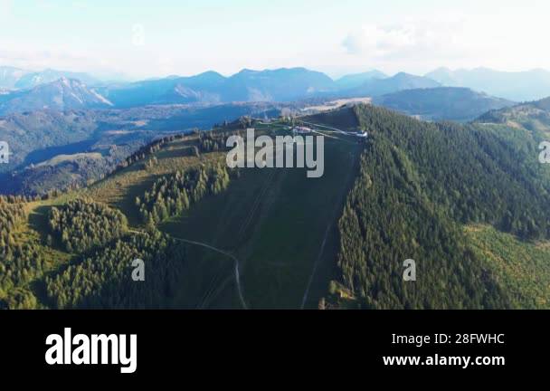 A panoramic view of a mountainous landscape in Austria features a ...