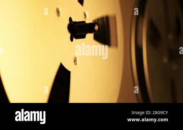 This video shows a detailed close-up of a vintage reel-to-reel machine ...