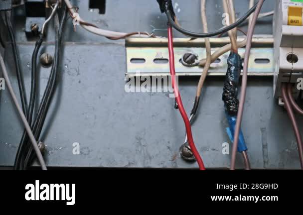 A close-up view of the internal wiring inside an electrical junction ...