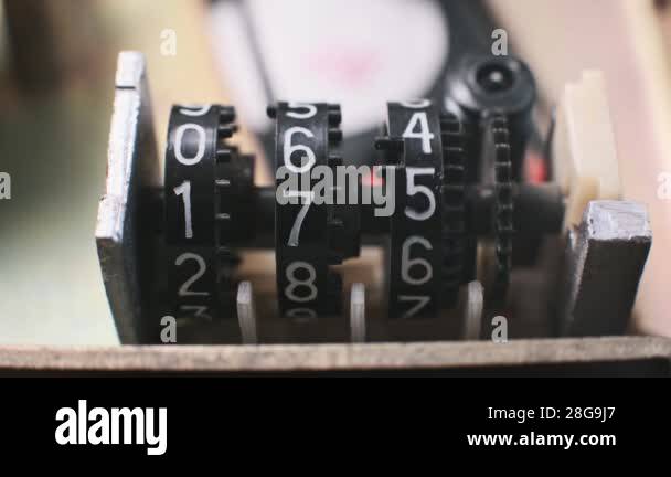 Detailed view of a retro mechanical counter, featuring rotating numbers ...