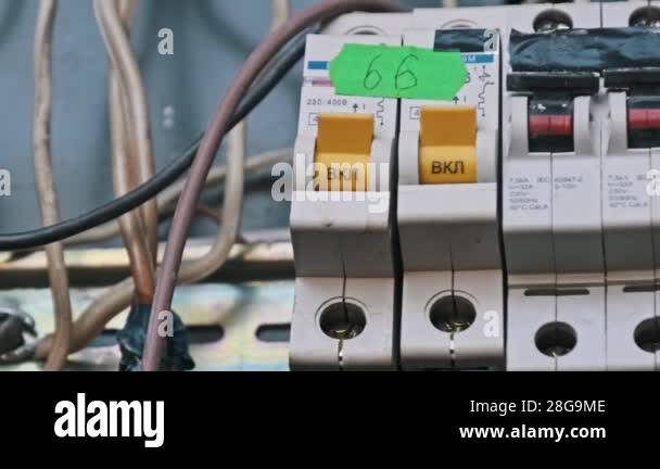 Extreme close-up of damaged wiring within an open electrical panel ...