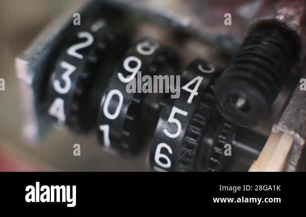 Macro shot of a vintage mechanical counter, focusing on the rotating ...