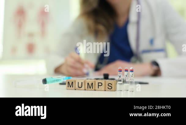 A healthcare professional thoroughly examines various mumpsrelated ...