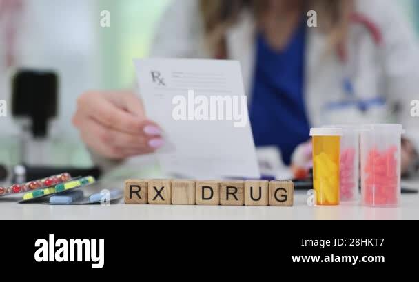 A healthcare professional reviews a prescription in the office with ...