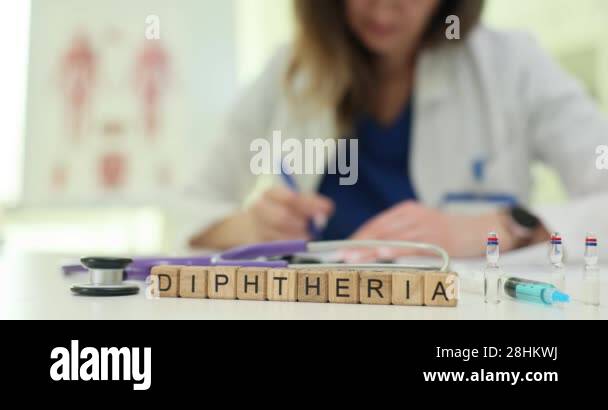 A skilled medical professional is thoroughly examining diphtheria while ...
