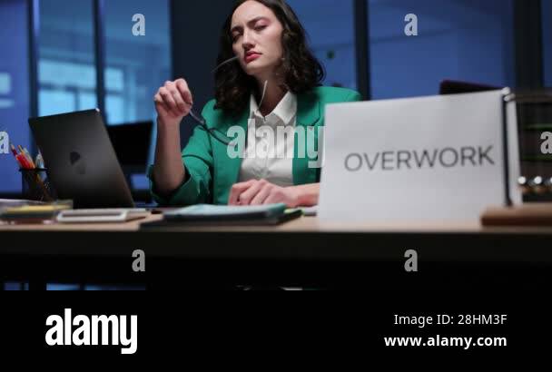 Exhausted businesswoman with severe headache from prolonged work and ...