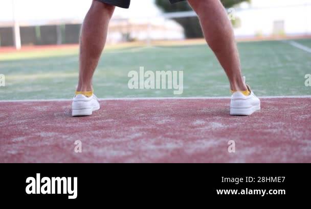 A runners impressive and powerful stance on the track vividly showcases ...