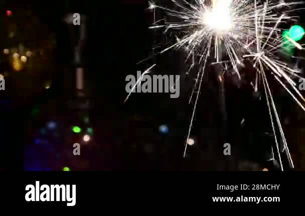 christmas background. fireworks in the dark room with lights on ...