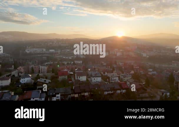 A stunning aerial view captures a Polish town bathed in the warm glow ...