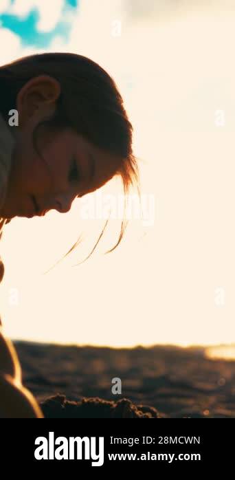 Close-up of a child hand digging in the sand at La Cala de Mijas beach ...