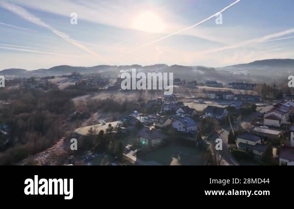 A breathtaking aerial view of a Polish town nestled amidst rolling ...
