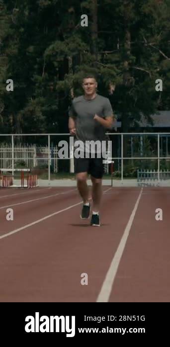 Full vertical shot of determined young Caucasian male para athlete with ...
