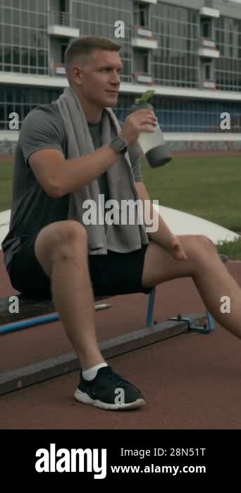 Full vertical shot of happy young Caucasian male athlete with acheiria ...