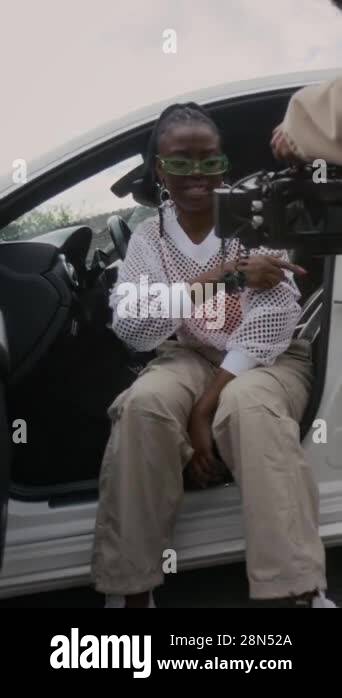 Vertical full shot of music video recording process - cameraman filming ...