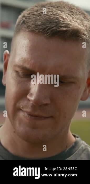 Extreme closeup vertical portrait of face of happy young Caucasian male ...