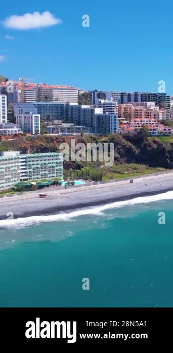 Aerial view of turquoise waters of Praia Formosa beach and colorful ...