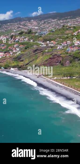 Aerial view of turquoise waters of Praia Formosa beach and colorful ...