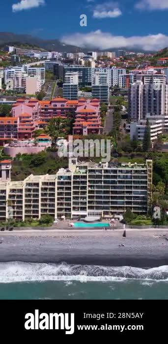 Aerial view of turquoise waters of Praia Formosa beach and colorful ...
