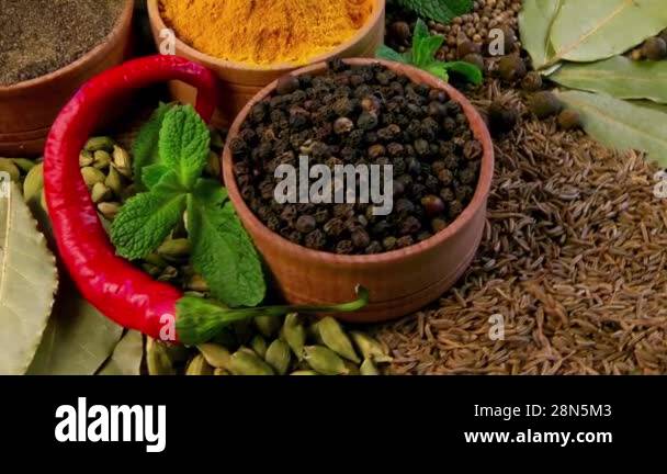 Aromatic spice mix: black peppercorns, turmeric, cumin seeds, coriander ...