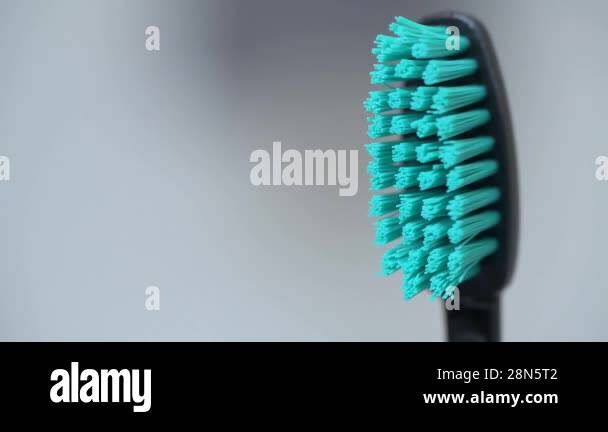 Close-up of a personal hygiene item. Movement of a toothbrush with a ...