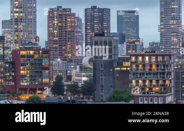 Aerial day to night transition timelapse of Katendrecht peninsula and ...