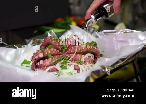 Mediterranean dish of stewed octopus, boiled whole potatoes, seasoned ...