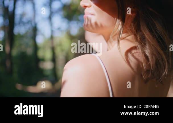Lady shoulder fern shadow at forest closeup. Gentle smiling model girl basking in bright sun ...