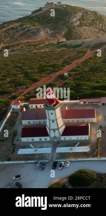 Aerial view of lighthouse on Cabo Espichel cape Espichel on Atlantic ocean. Pedestal shot Stock ...