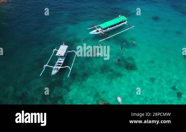 Aerial view of Snorkeling and scuba diving boats with people exploring ...