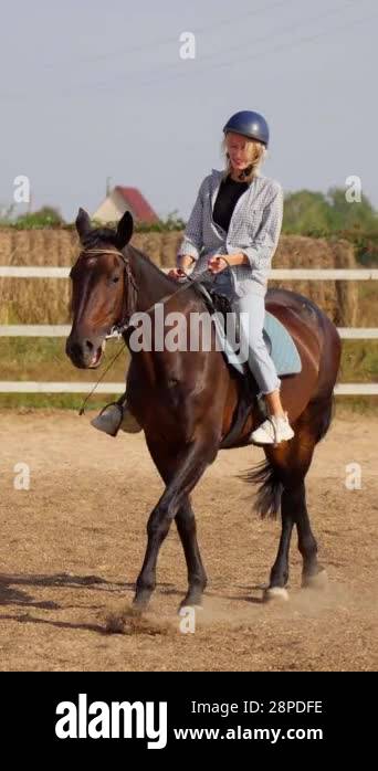 Horseback riding training session featuring young athlete trotting in ...