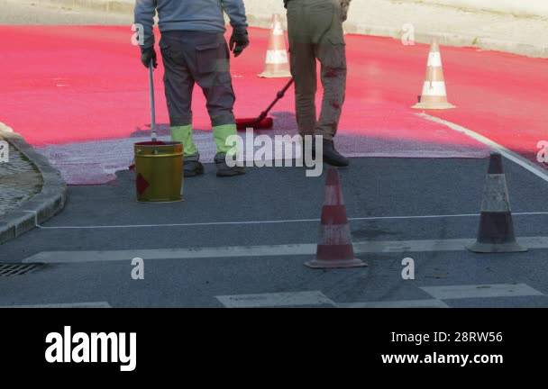 Process of painting for speed restricting road surface marking with red ...