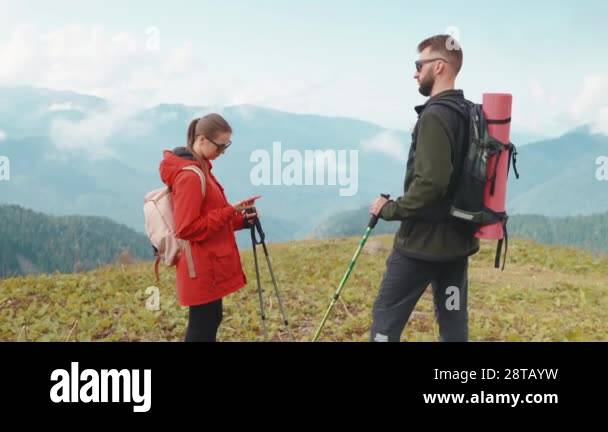 expedition in mountains, man and woman tourists or scientists ...