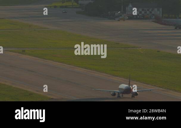 Passeger plane take off, rear view. Footage of aeroplane on the runway ...