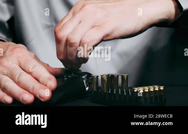 Loading of small personal two barrel derringer handgun of .38 special ...