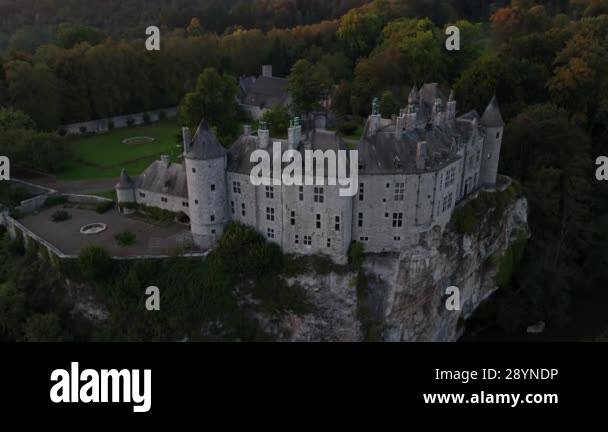 Journey through the captivating landscape of Walzin Castle, perched ...