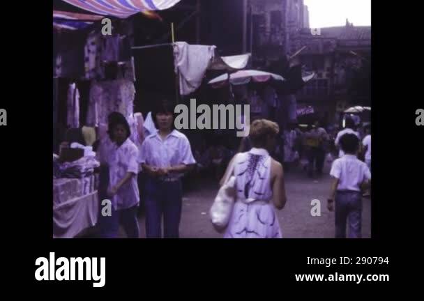 Hong kong, june 1985: street vendors selling various goods, shoppers ...