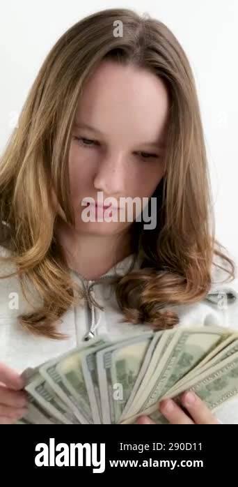 dollar bills in the hands of a person. A woman counts money, hands close-up. Concept of business ...