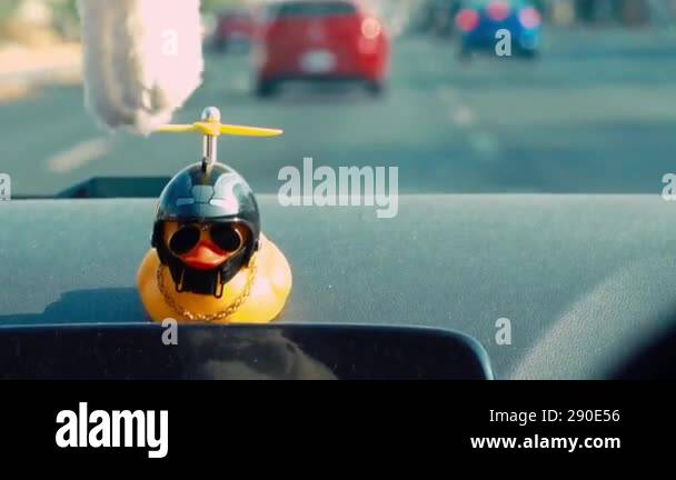 Unique rubber duck with helicopter propeller and sunglasses on car ...