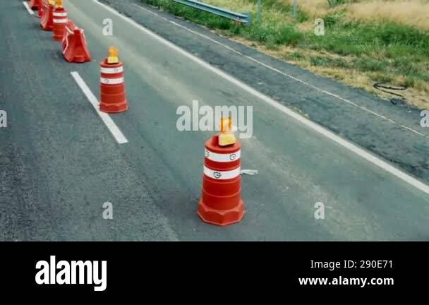 Road construction with safety cones marking work zone on highway Stock ...