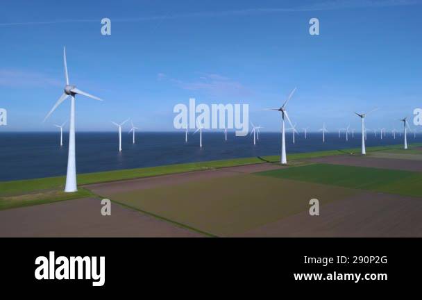 Breathtaking views of towering windmill turbines lined along the ...