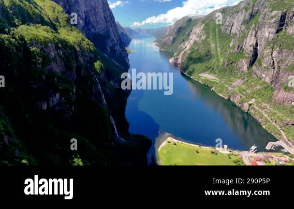 Experience the breathtaking beauty of Norways fjords, where lush cliffs ...