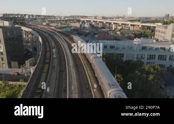 Aerial view of an above ground subway passing through Brooklyn on a ...