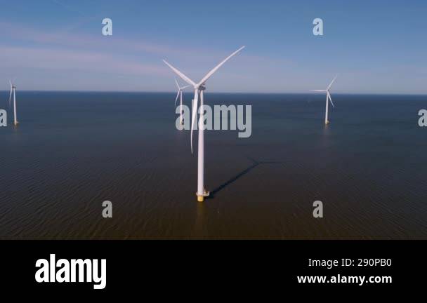 Witness the impressive wind turbines, Windmill park in the ocean, drone ...